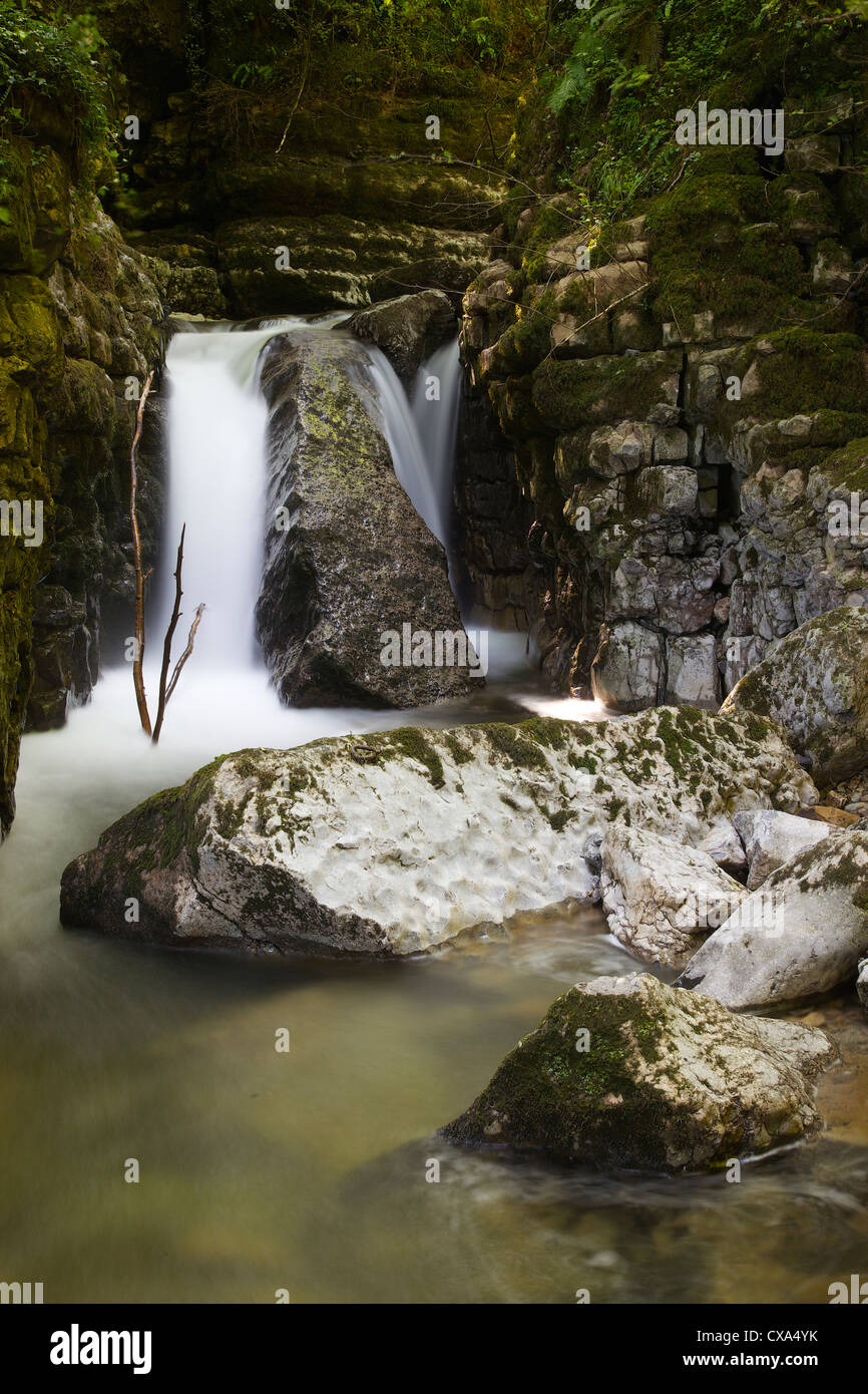 Waterfall in limestone gully at The Howk, Caldbeck, Lake District ...