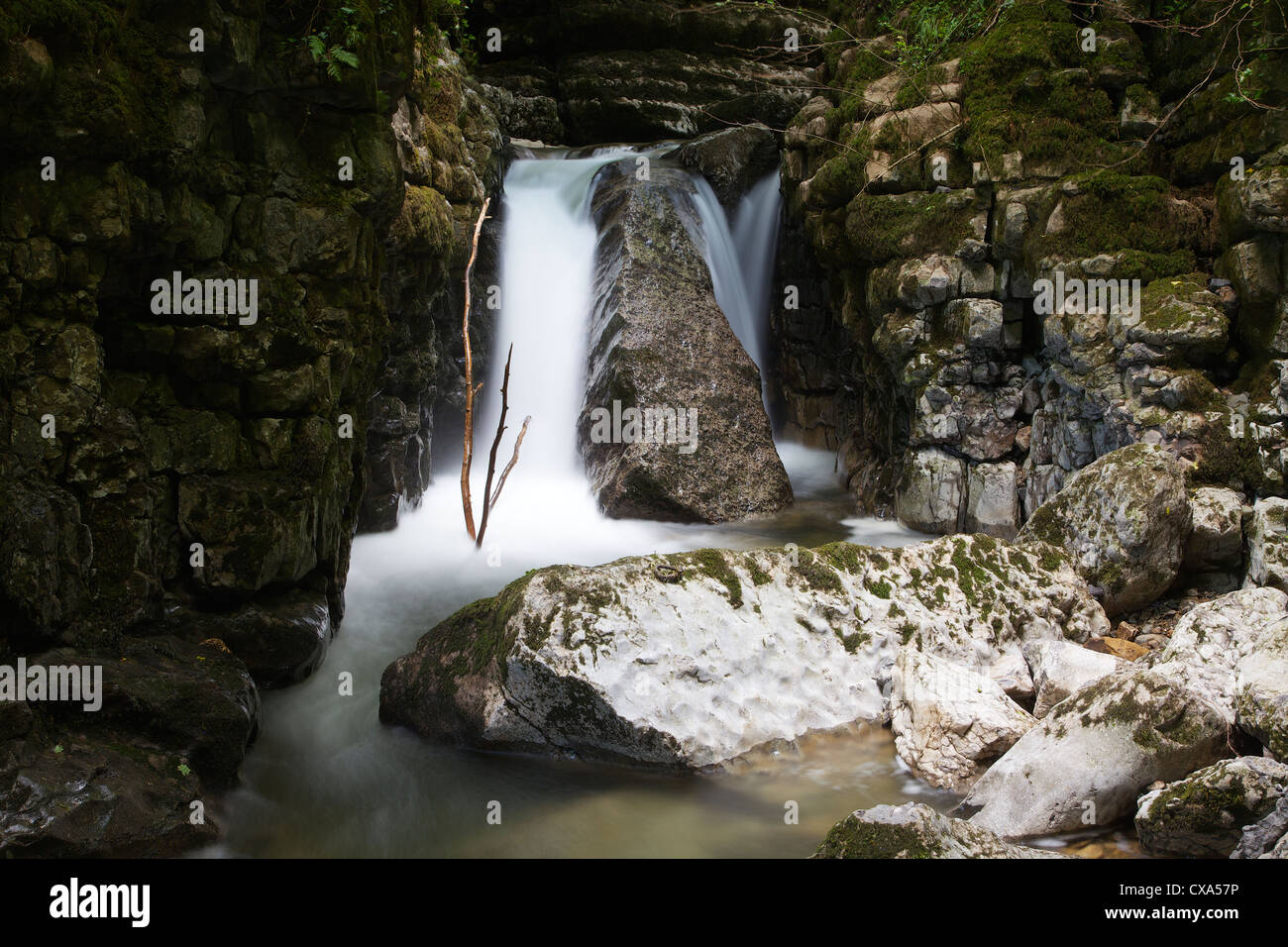 Waterfall in limestone gully at The Howk, Caldbeck, Lake District ...