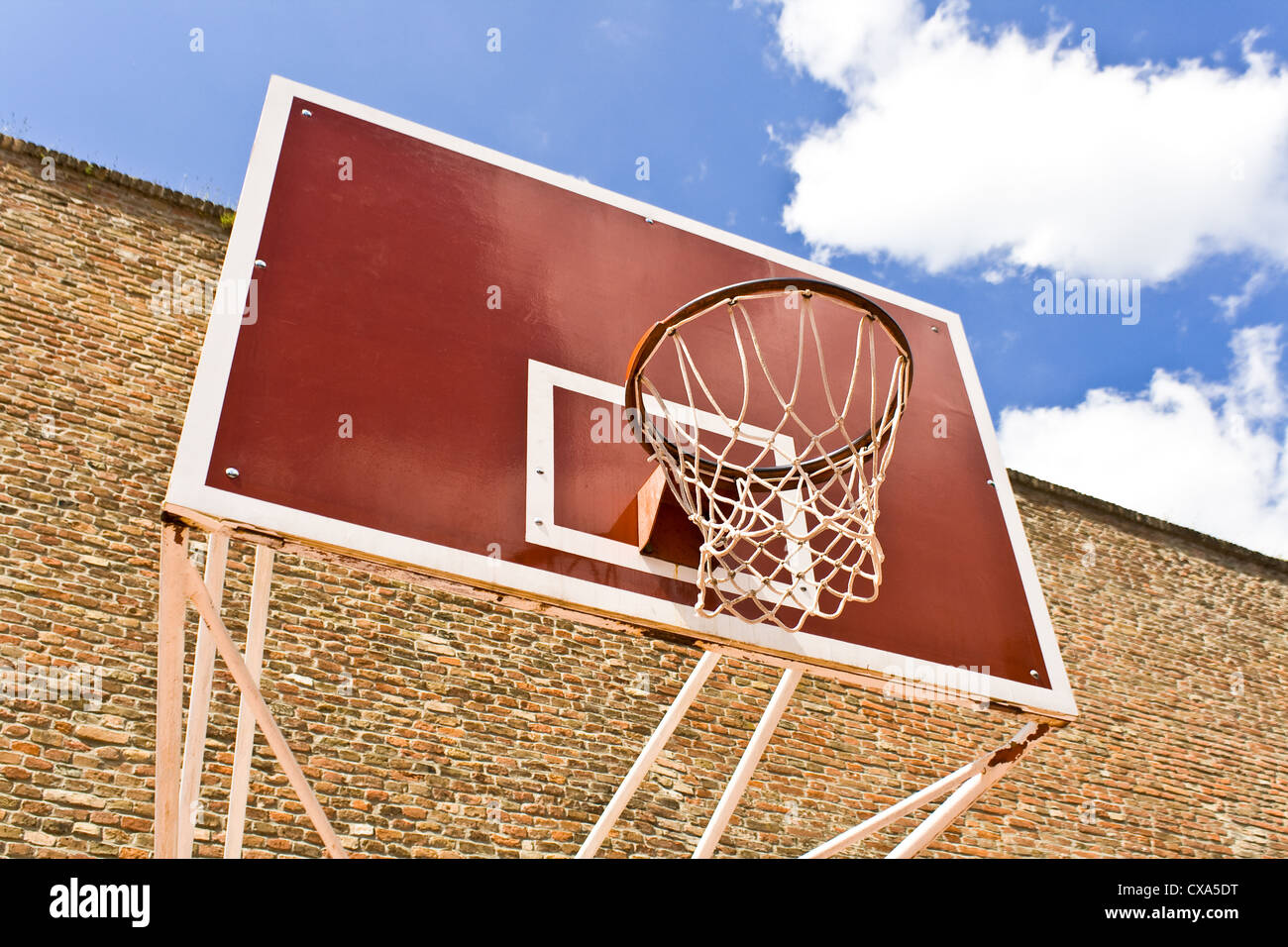 Red basketball board over brick wall and blue sky Stock Photo - Alamy