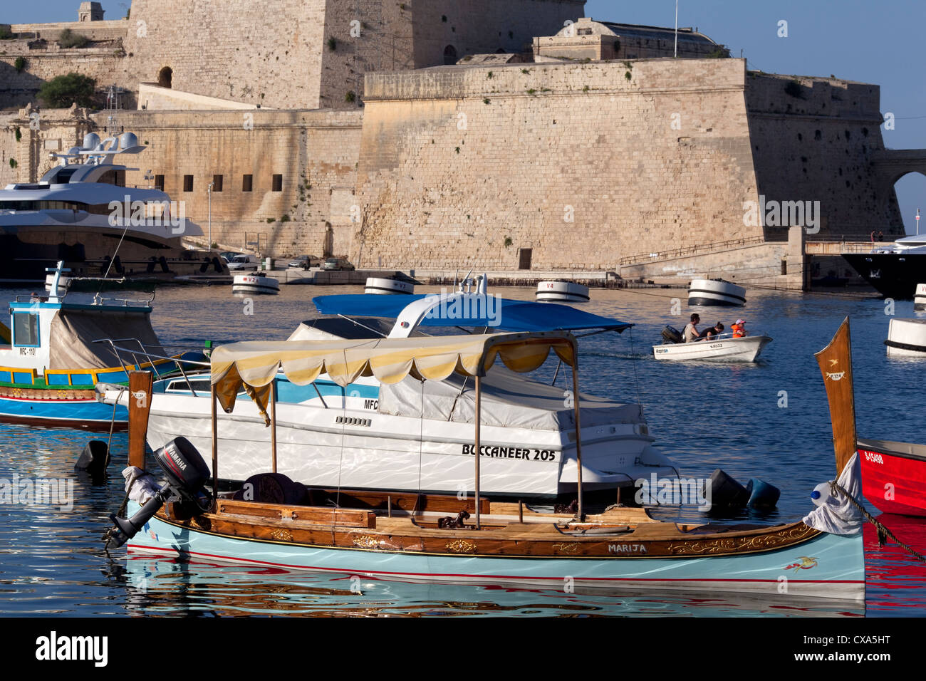 Colourful traditional luzzu fishing boats Marsaxlokk harbour Malta ...
