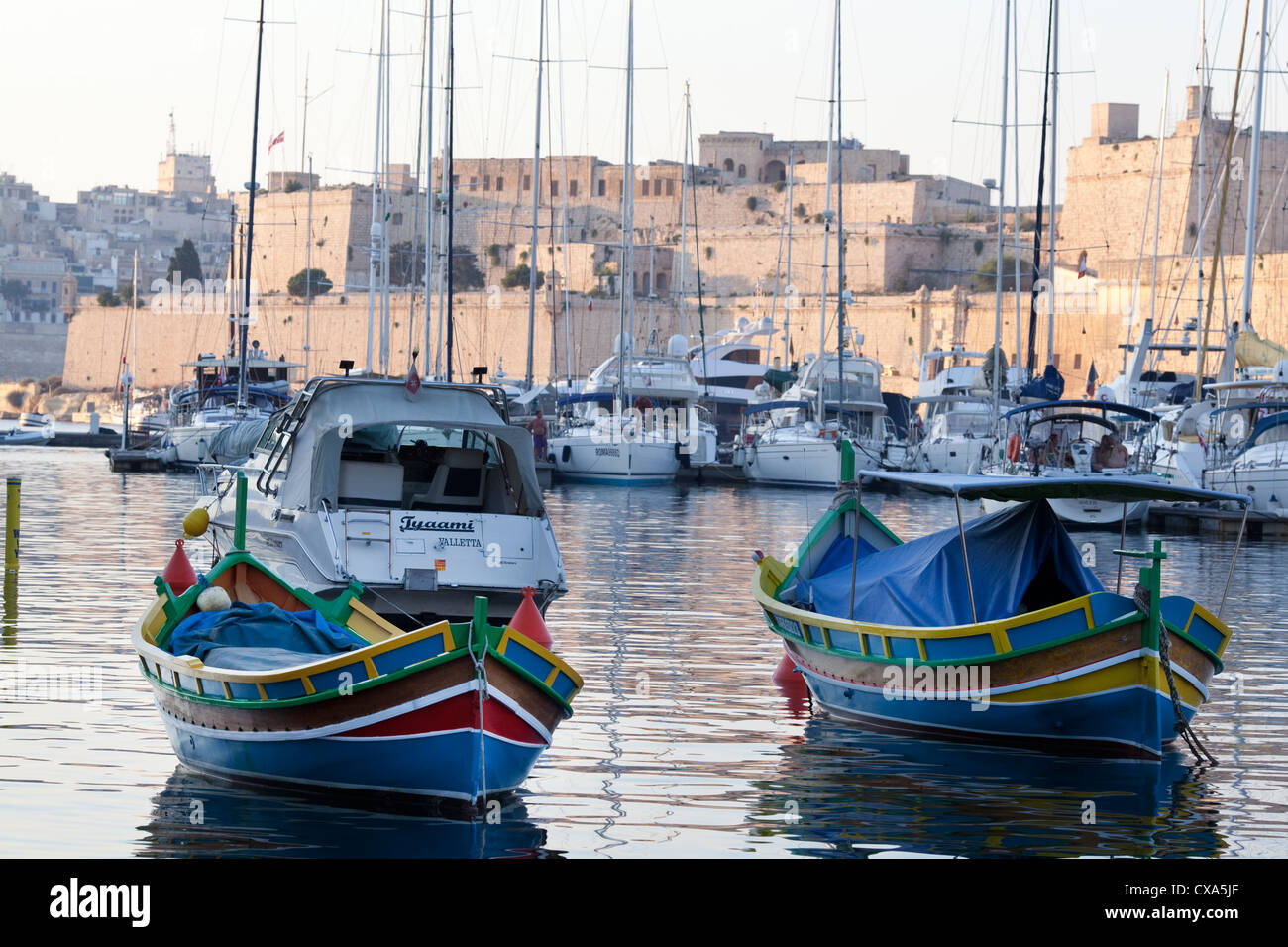 Colourful traditional luzzu fishing boats Marsaxlokk harbour Malta ...