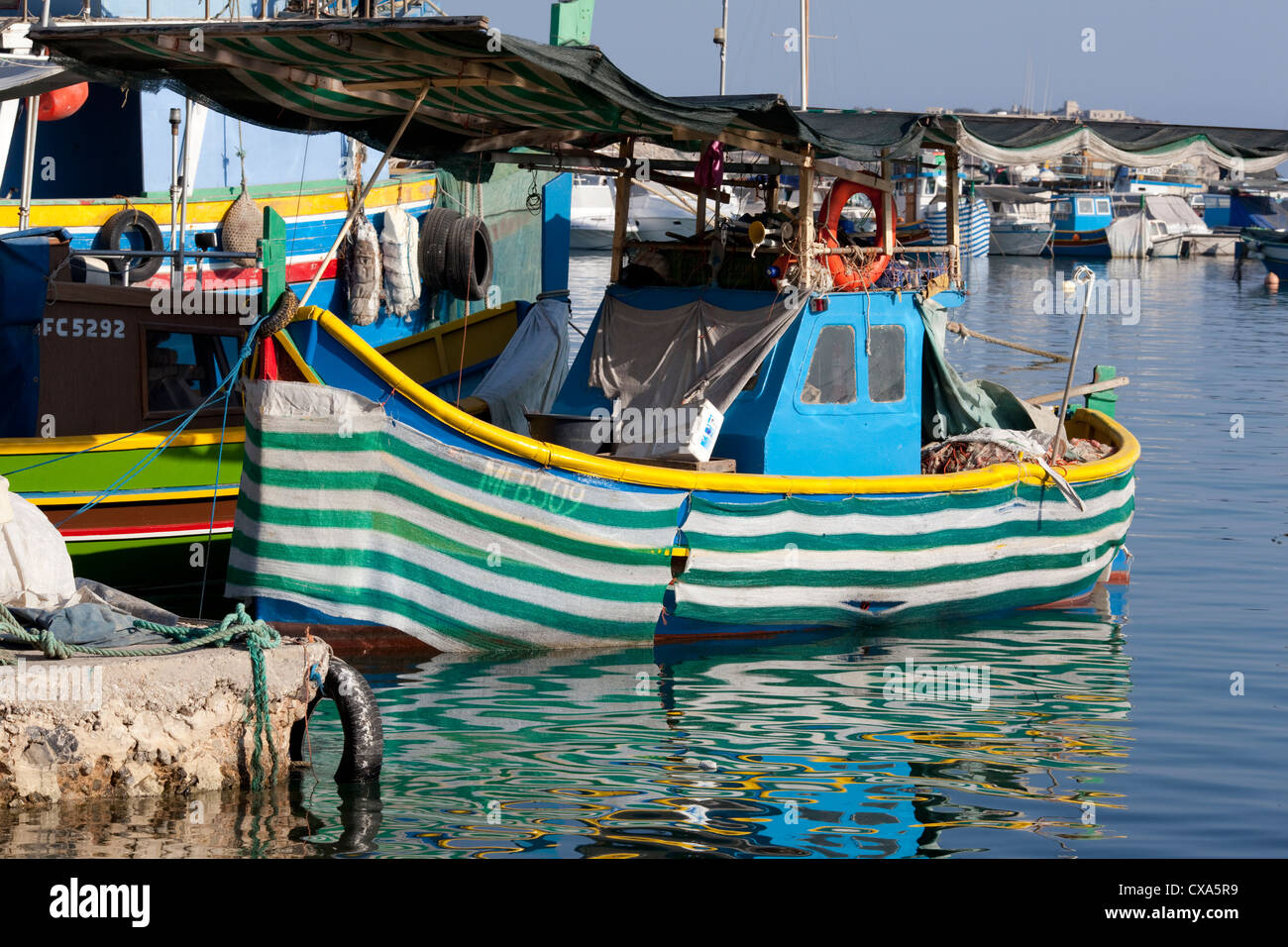 Colourful traditional luzzu fishing boats Marsaxlokk harbour Malta ...