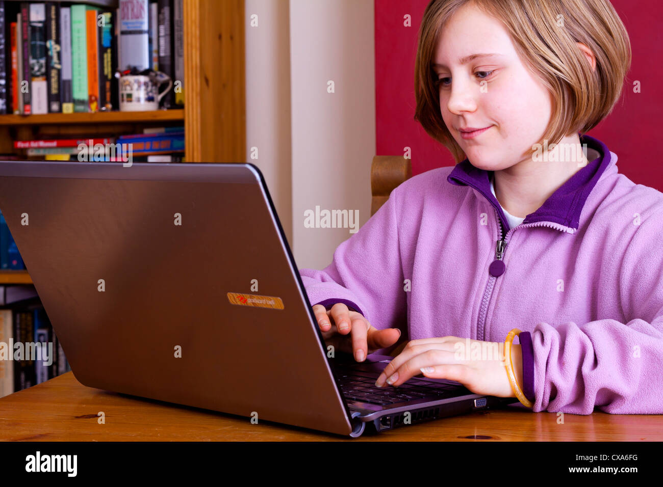 Ten year old girl using a laptop computer Stock Photo - Alamy