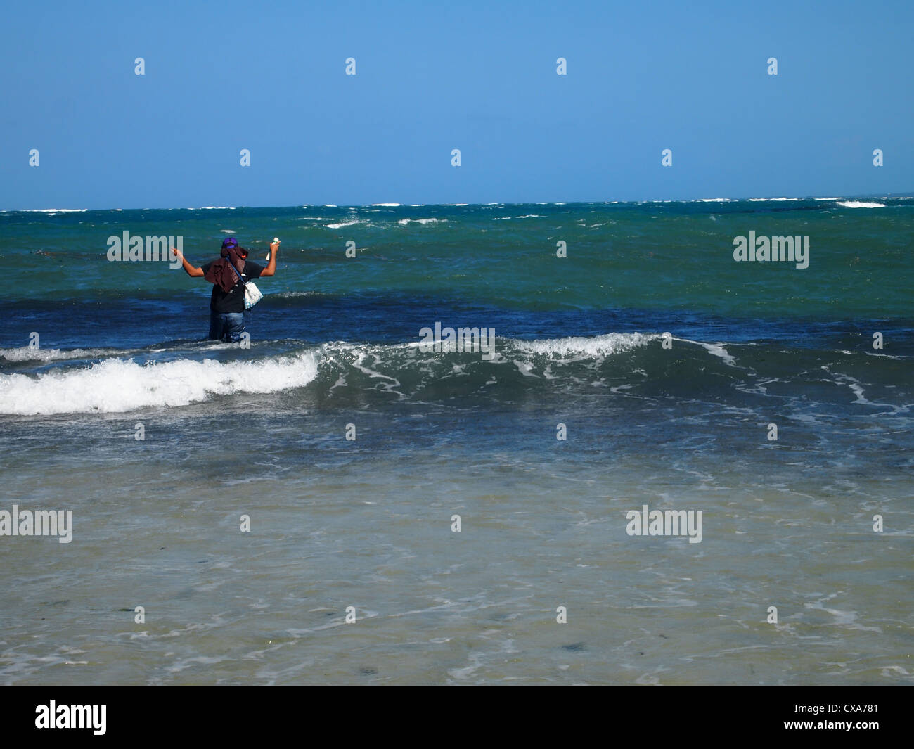 A fisherman in the sea Stock Photo - Alamy