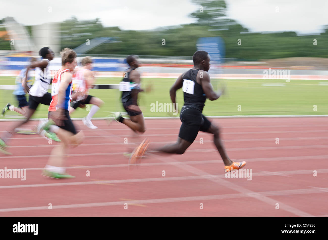 Blurred colourful motion and action of track and field events 100m ...