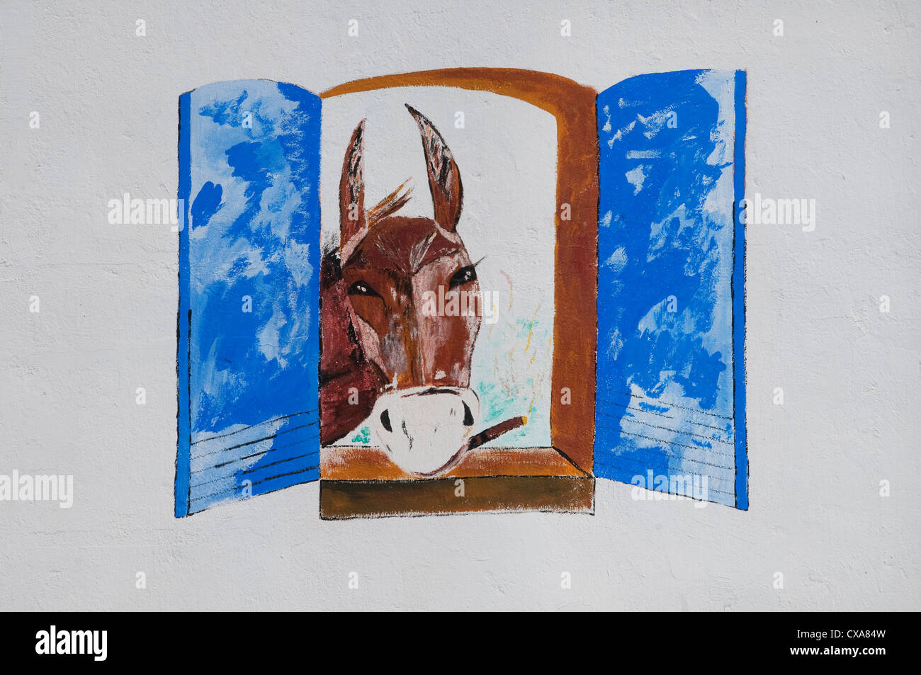 donkey smoking cigar on house wall, santorini, greece Stock Photo - Alamy
