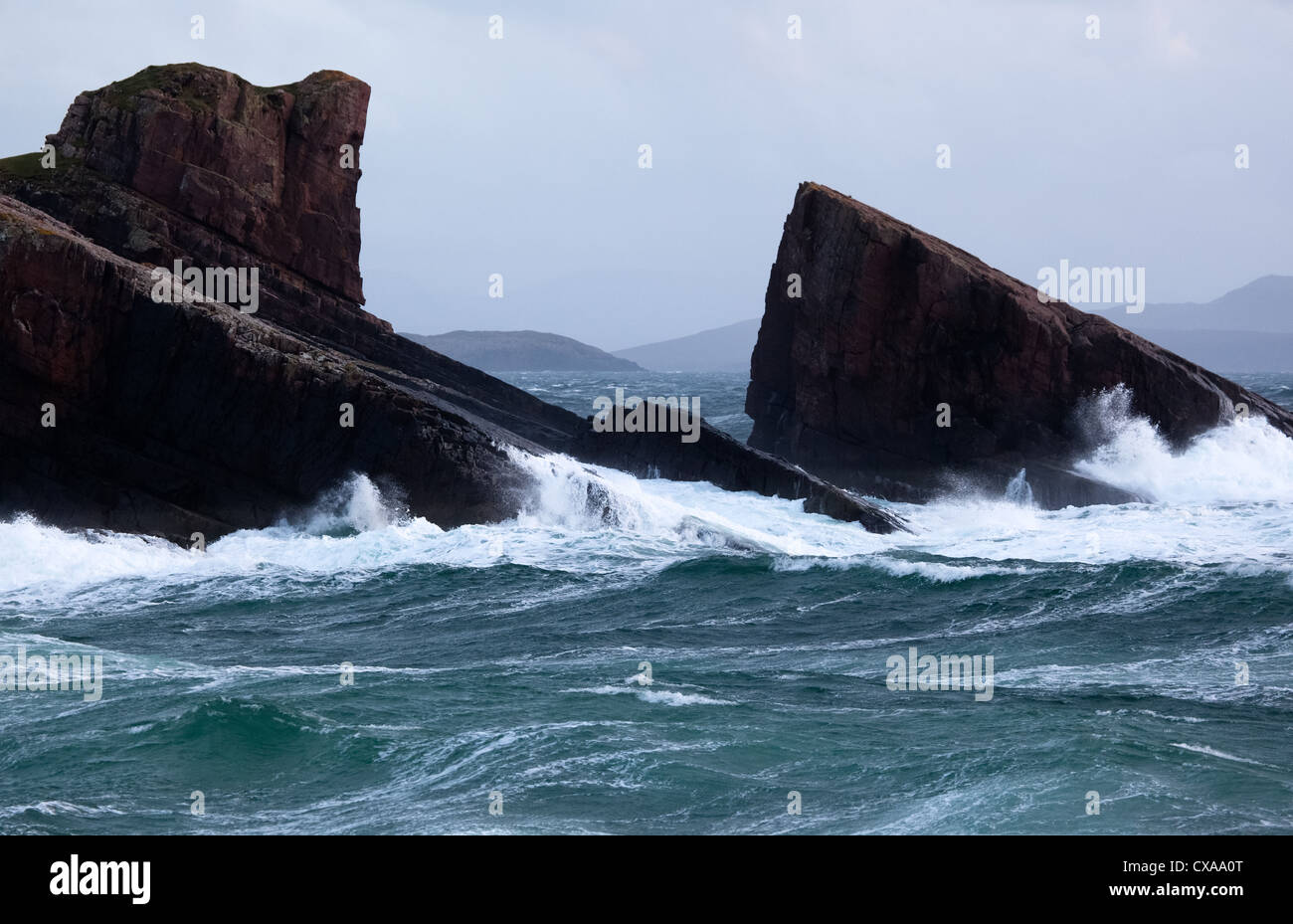 Rough seas pound Split Rock at Clachtoll Bay in the North West ...