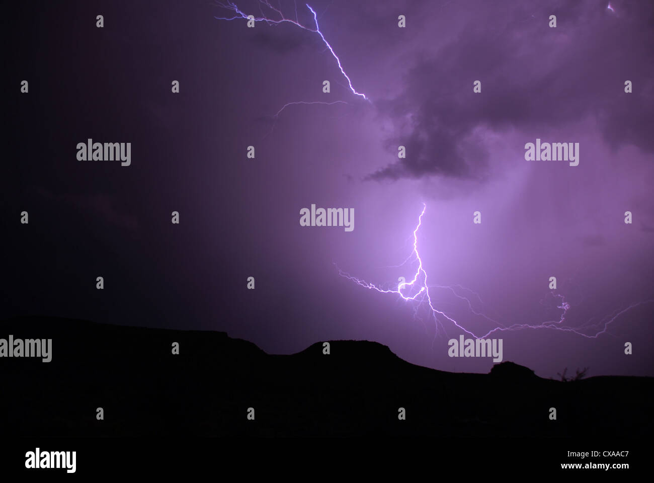 Bolt of Lightning Arcing Through a Night Sky Stock Photo - Alamy