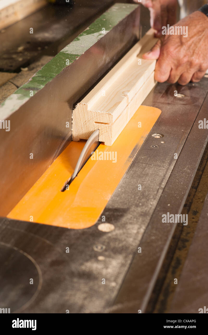Carpenter hands working on a sawing table Stock Photo - Alamy