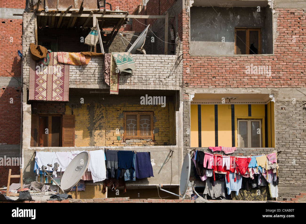 View of a semi-constructed building in a poor Cairo area, Egypt -These ...