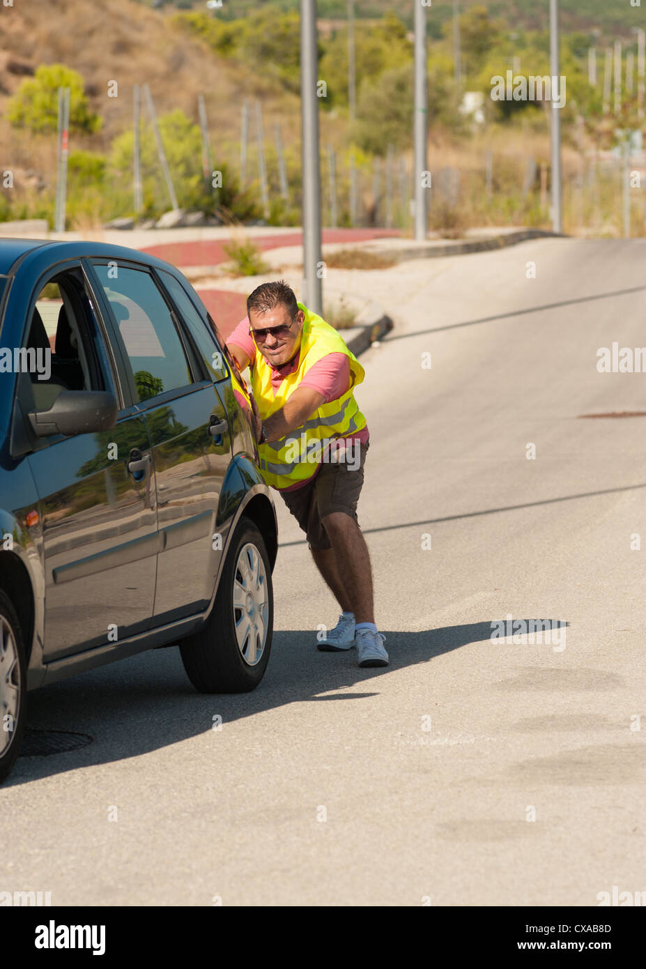Pushing a car uphill hi-res stock photography and images - Alamy