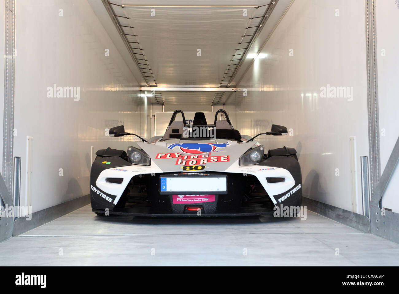 Racing car inside of a trailer at the International Motor Show for ...