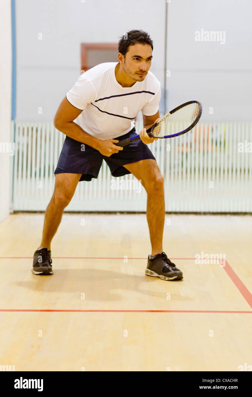 Hispanic man playing squash Stock Photo - Alamy
