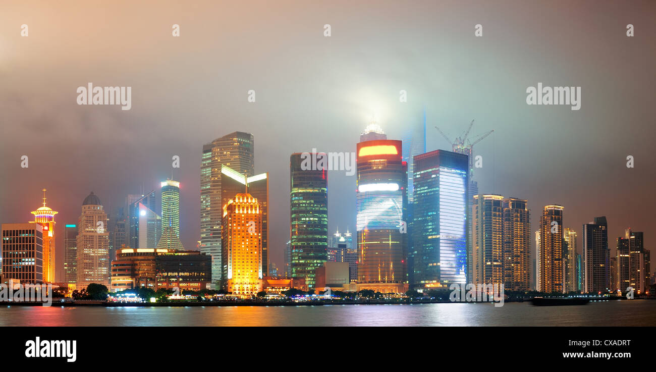 Shanghai urban architecture over river at dusk Stock Photo - Alamy