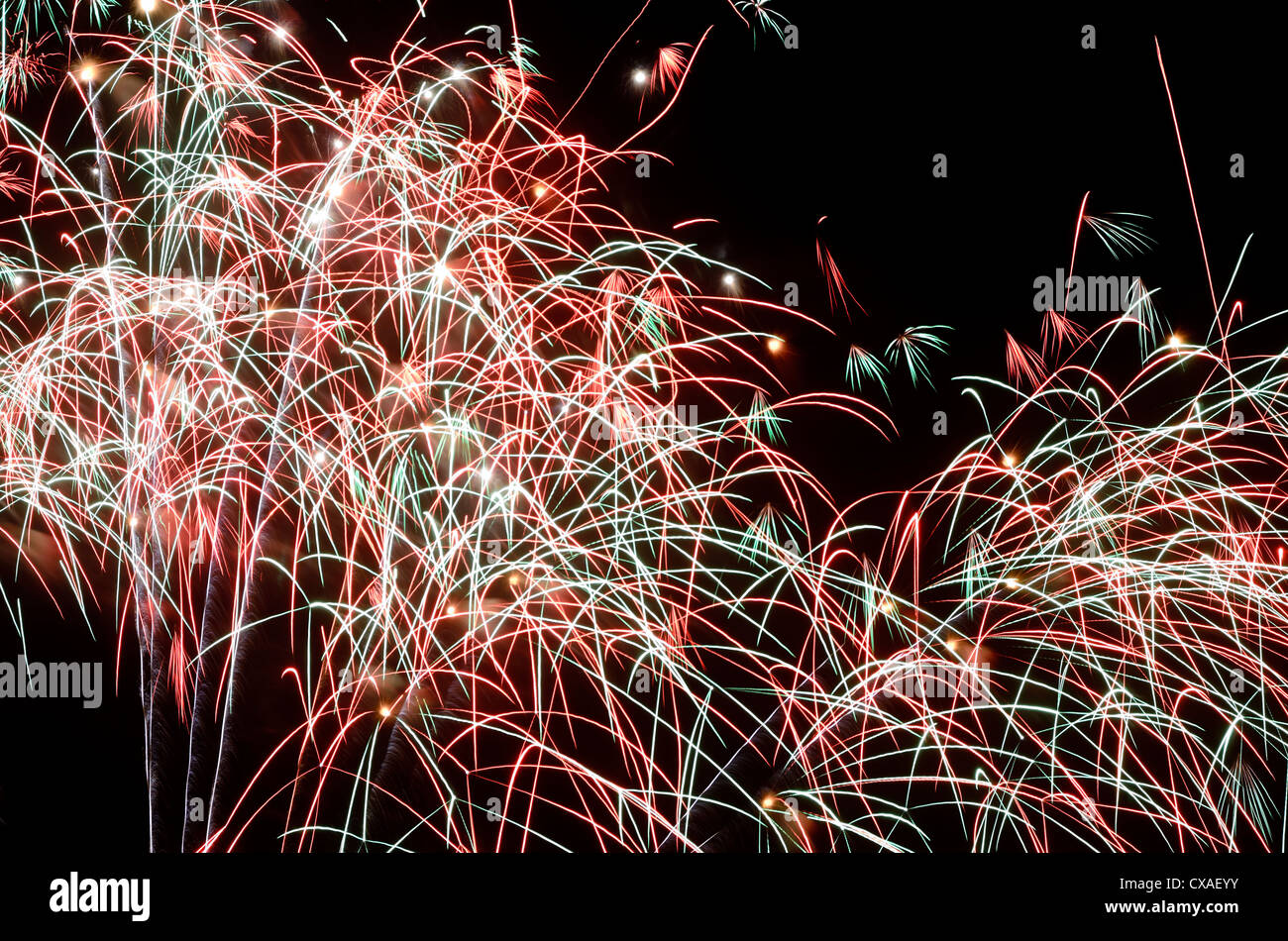 Fireworks light up the night sky during a New Year's celebration Stock ...