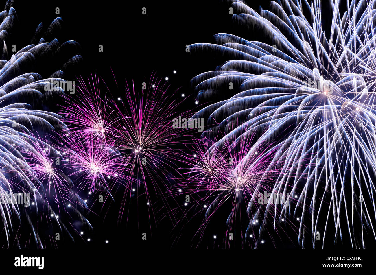 Fireworks light up the night sky during a New Year's celebration Stock ...