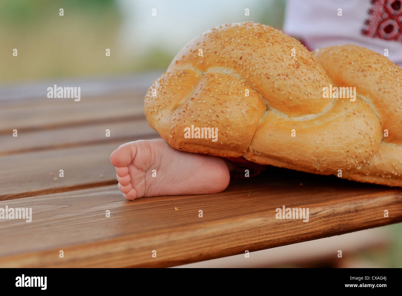braided bread on the bench Stock Photo - Alamy