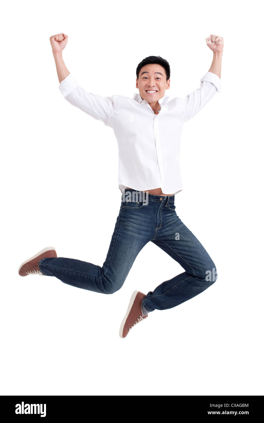Young man jumping in mid air Stock Photo - Alamy
