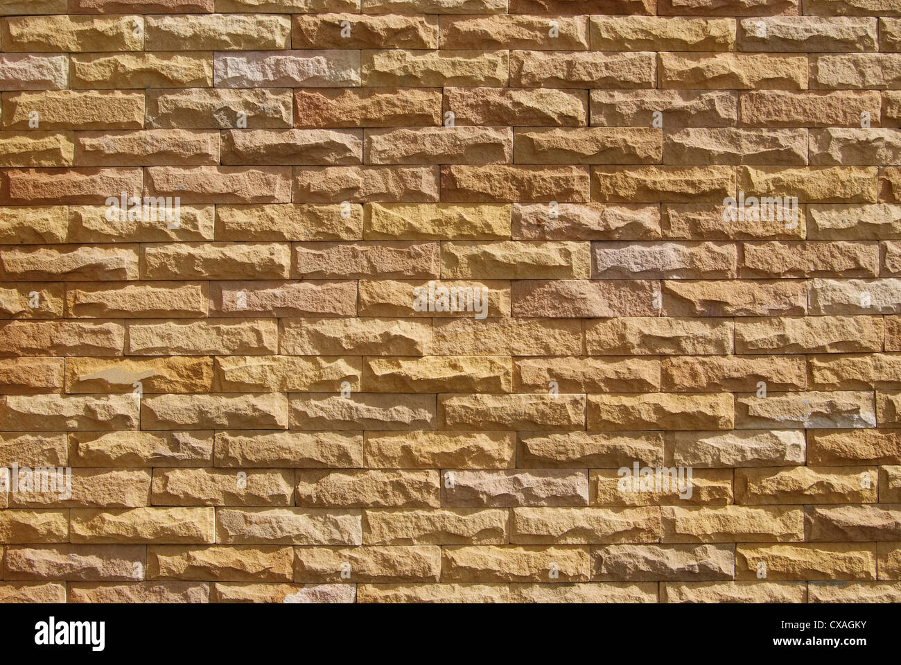 Sand stone wall surface, background of decorate Stock Photo - Alamy