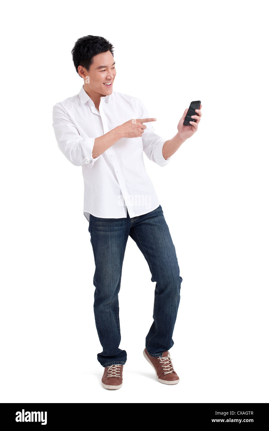 Young man showing mobile phone Stock Photo - Alamy