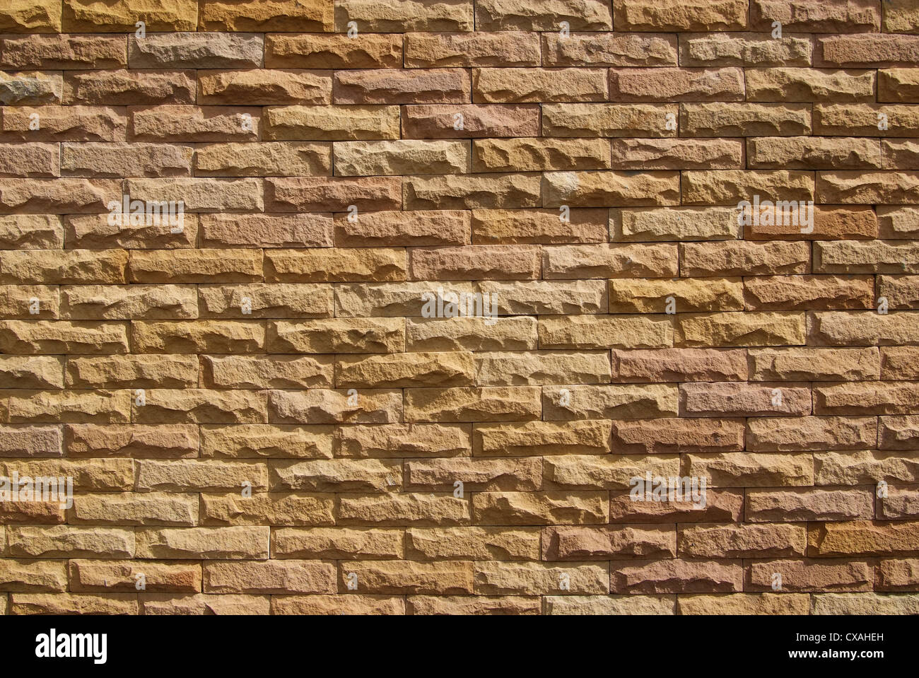 Sand stone wall surface, background of decorate Stock Photo - Alamy