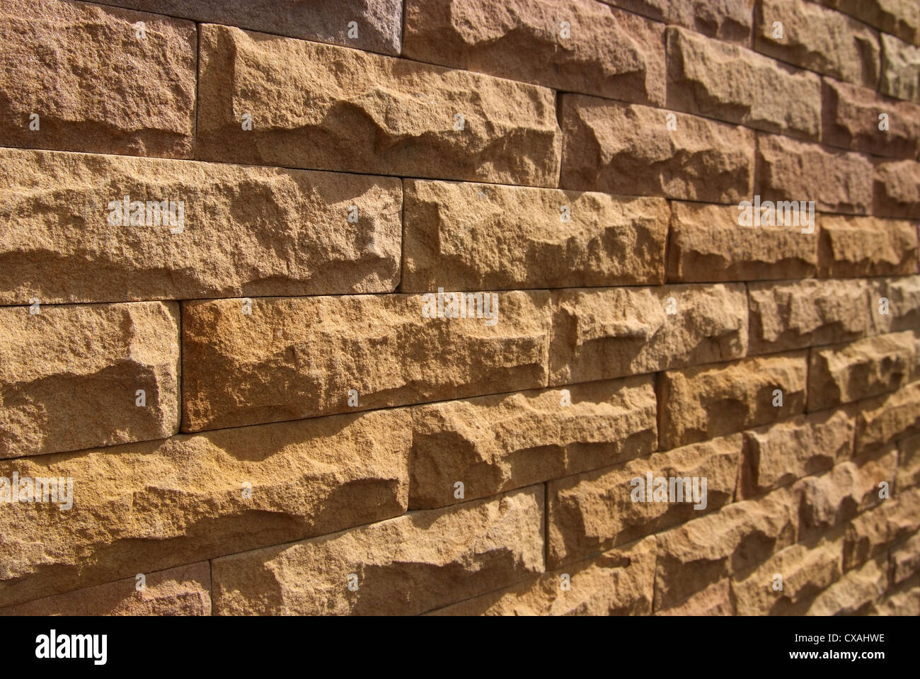 Sand stone wall surface, background of decorate Stock Photo - Alamy