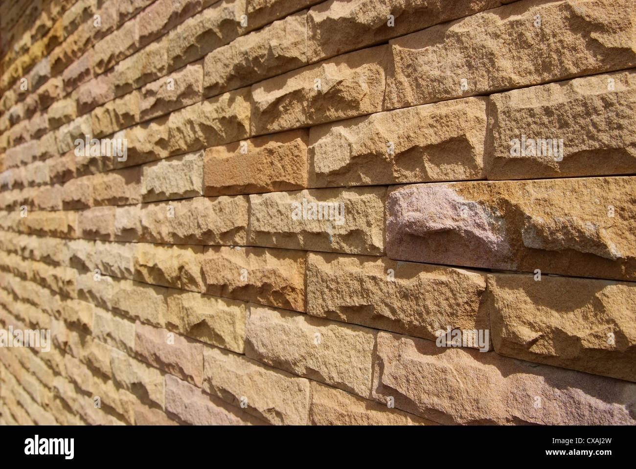 Sand stone wall surface, background of decorate Stock Photo - Alamy