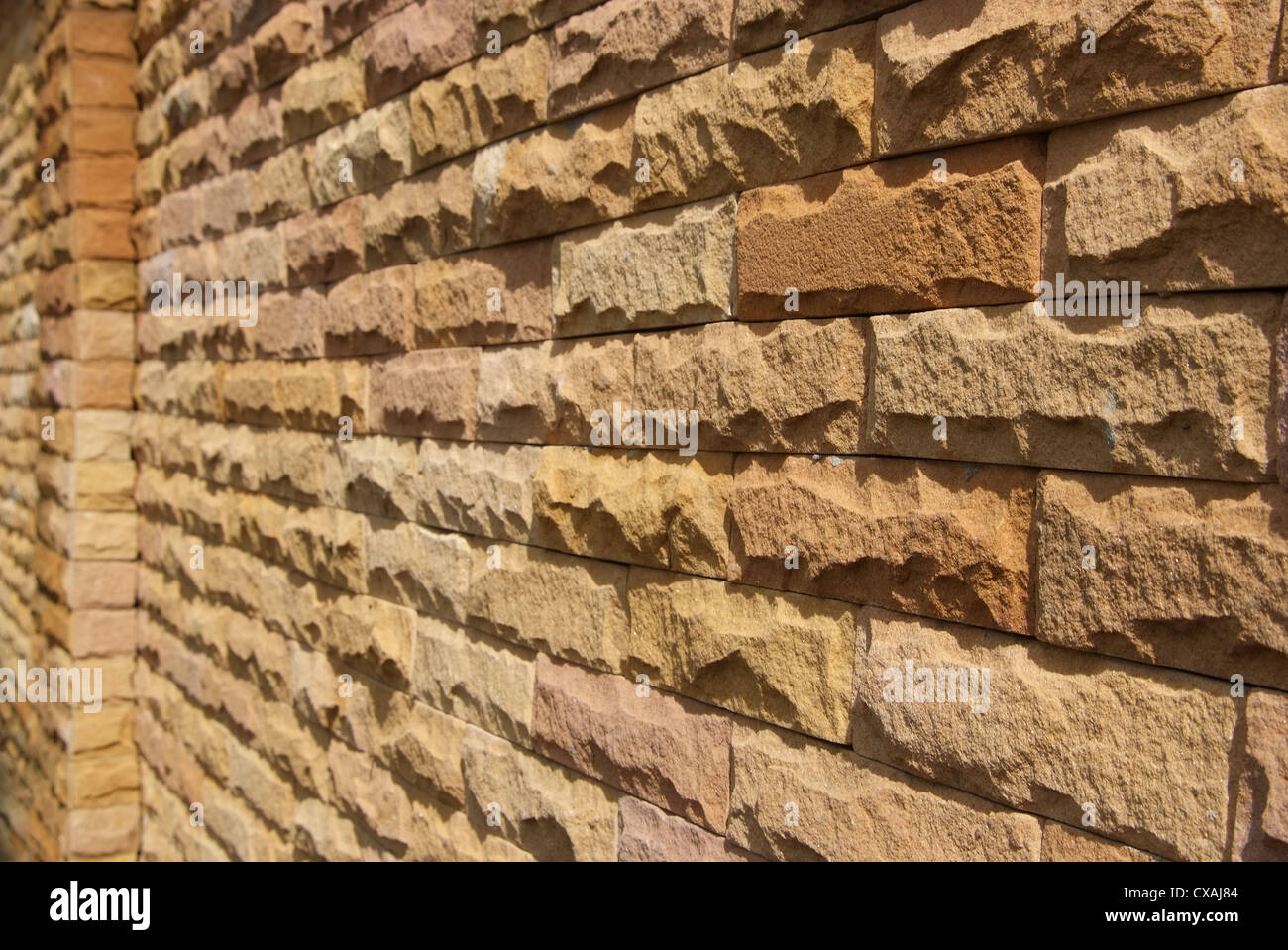 Sand stone wall surface, background of decorate Stock Photo - Alamy