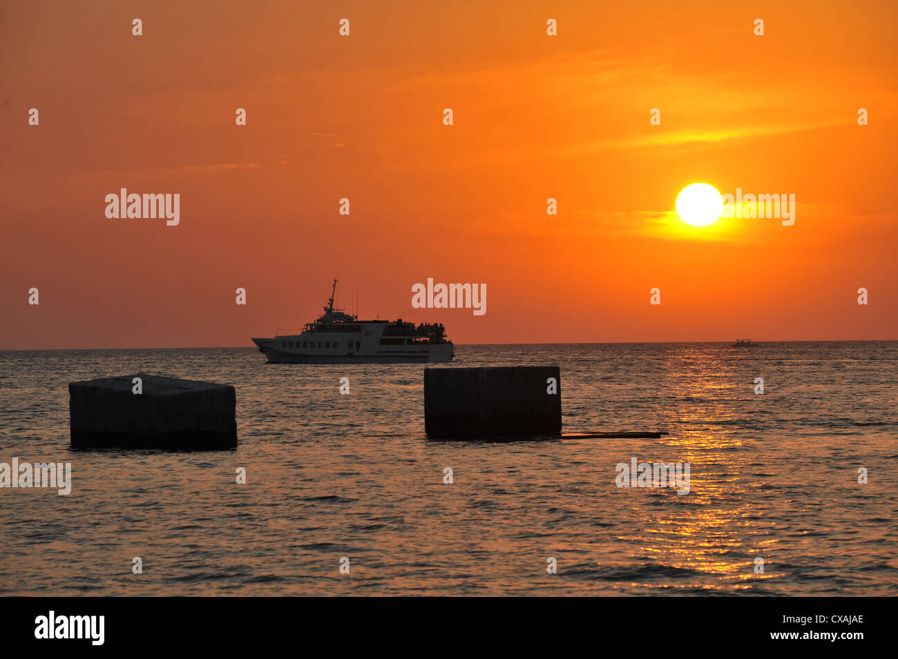 Sunset & ship Stock Photo - Alamy