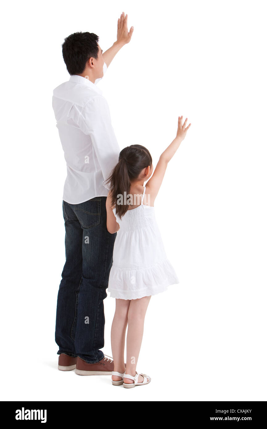 Father and daughter waving to the front Stock Photo - Alamy