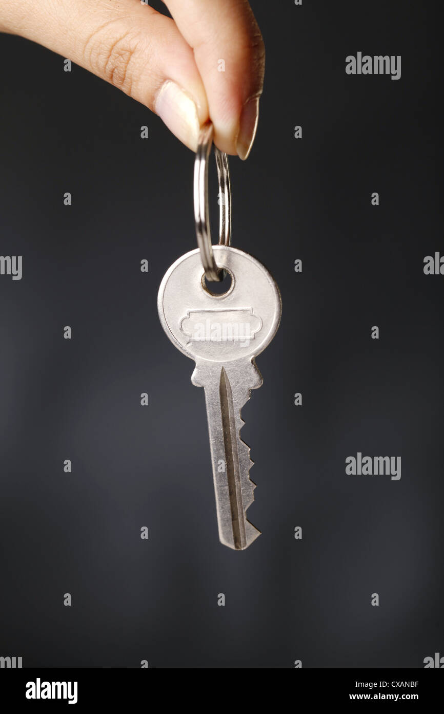 Closeup of hand holding a key Stock Photo - Alamy