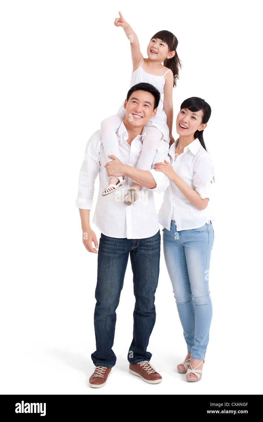 Happy family pointing the front Stock Photo - Alamy