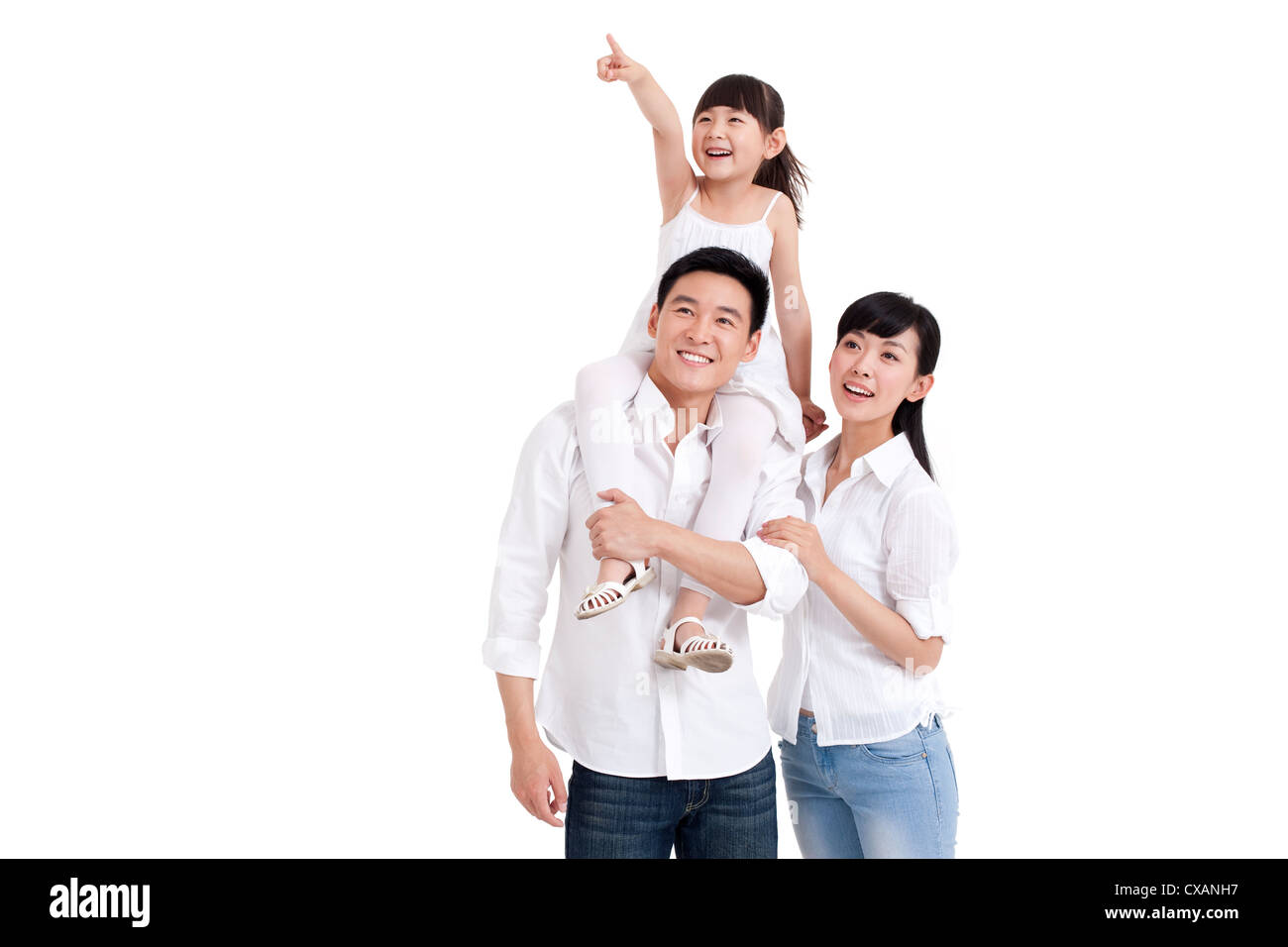 Happy family pointing the front Stock Photo - Alamy
