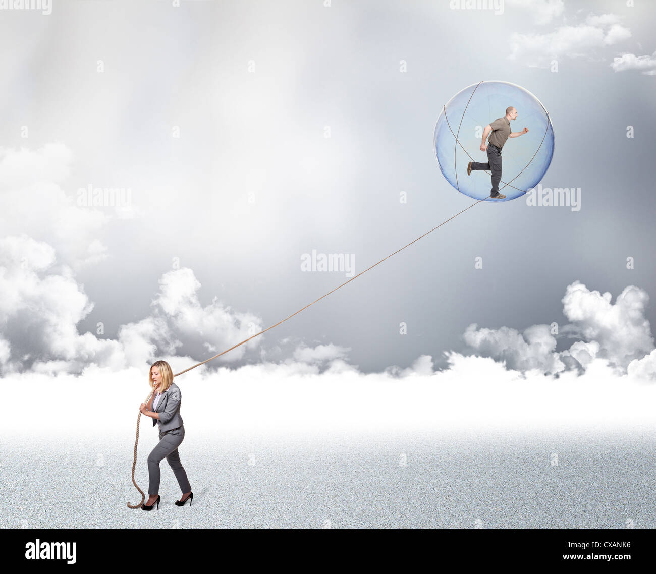 caucasian woman catch and pull soap bubble with man inside Stock Photo ...