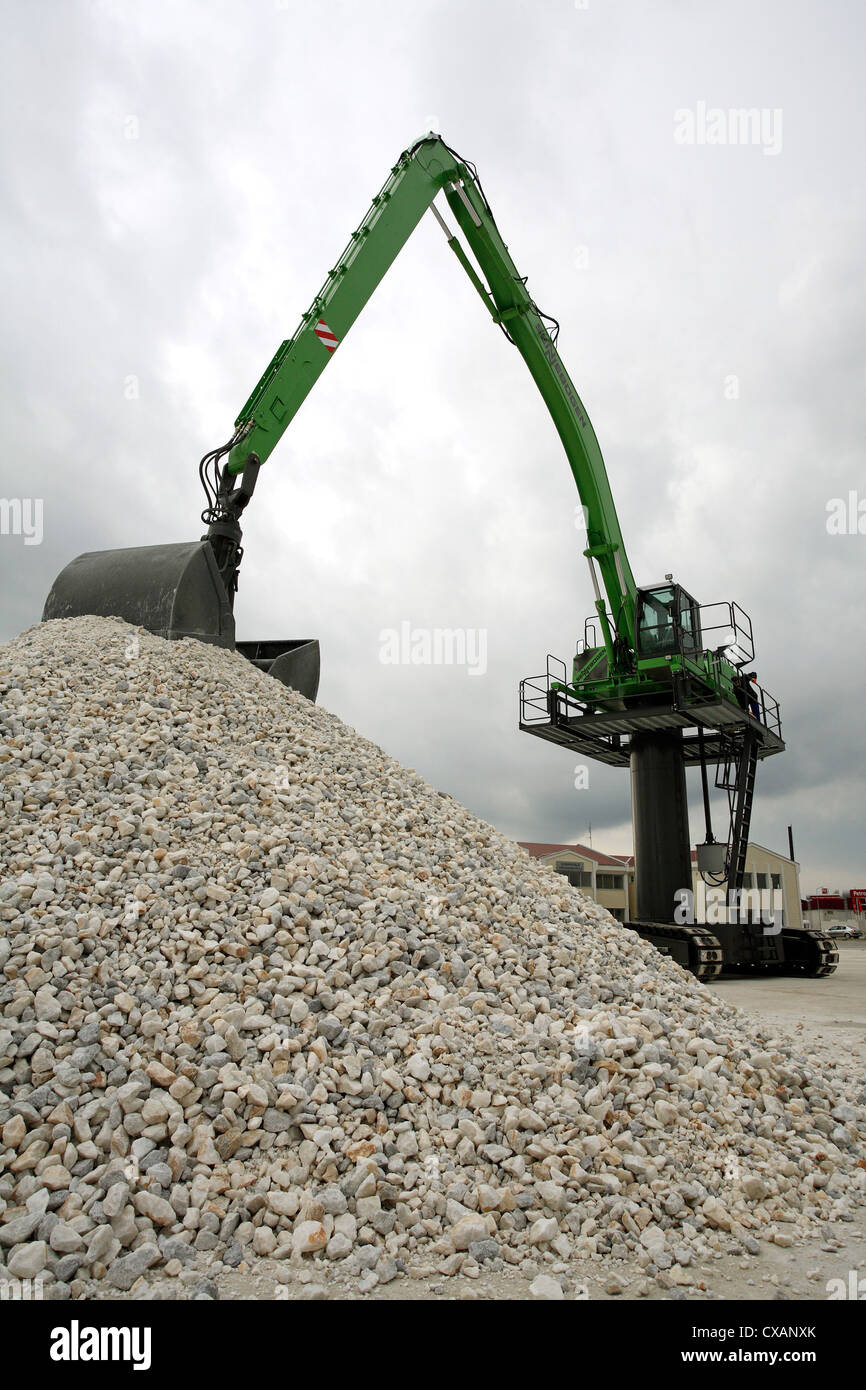 Canakkale, shovel digs in a marble pile of gravel Stock Photo - Alamy