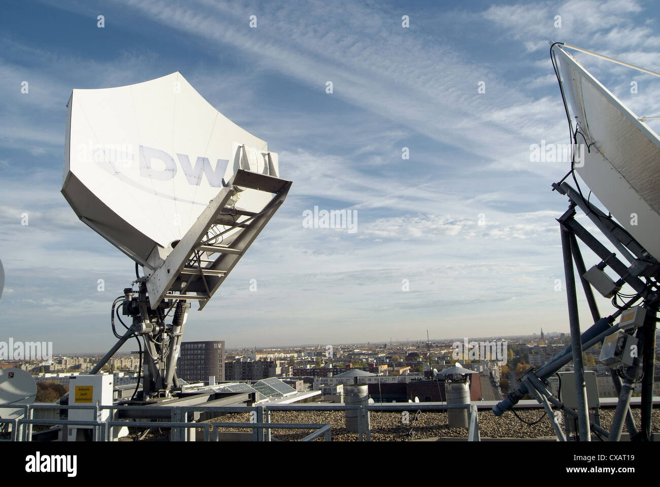 Berlin, German wave of TV satellite dishes on the roof Stock Photo - Alamy