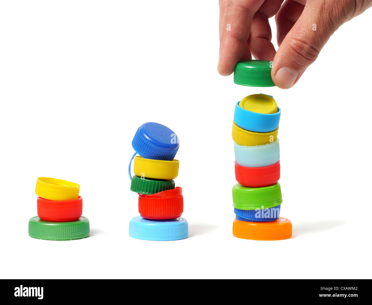 Stacks made from bottle caps on white background Stock Photo - Alamy