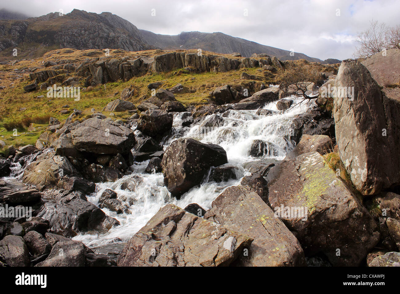 River Idwal drains from Llyn Idwal, in Cwn Idwal before tumbling down ...