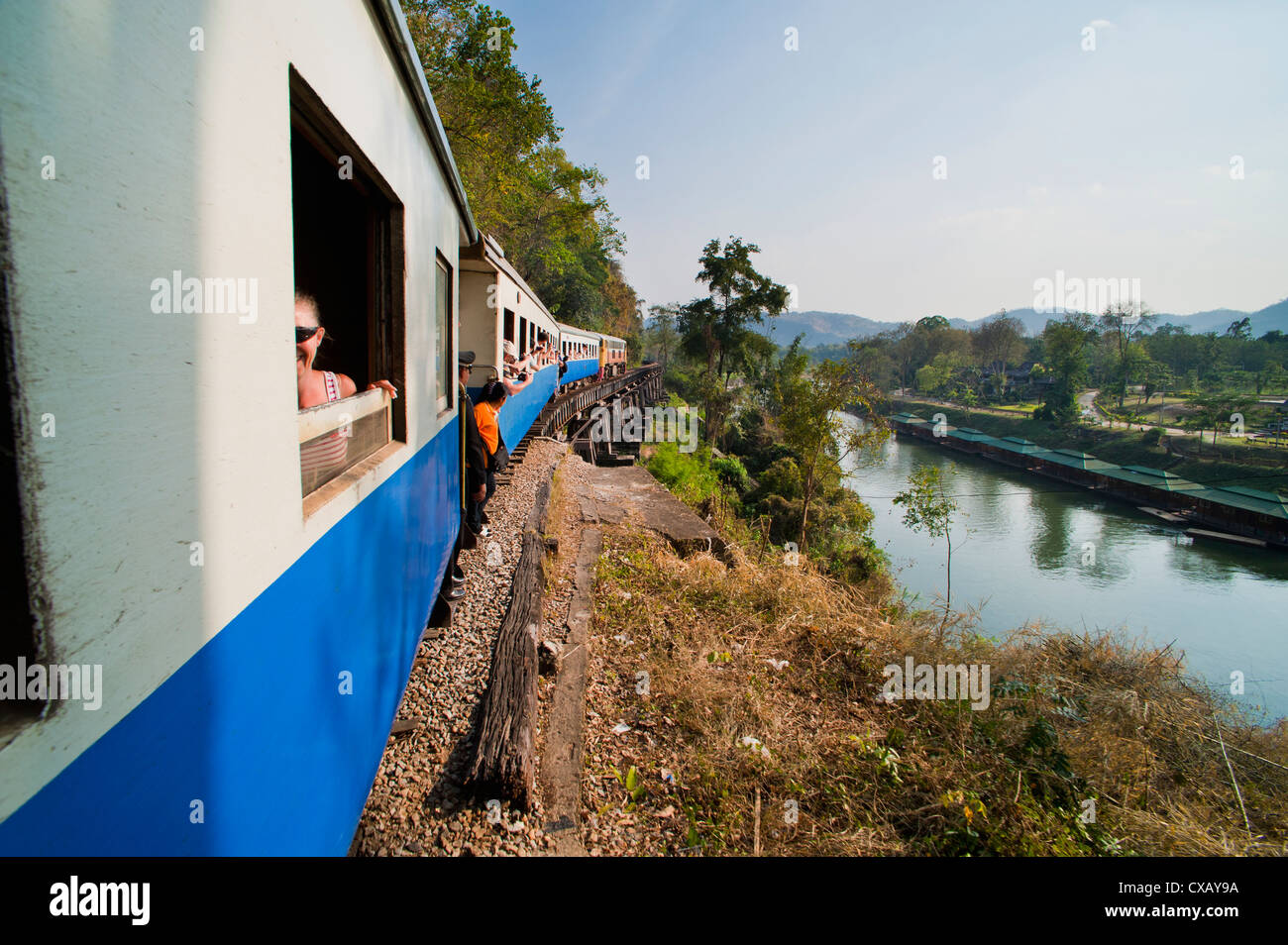 Tourists on a train ride on the Death Railway along the River Kwai ...