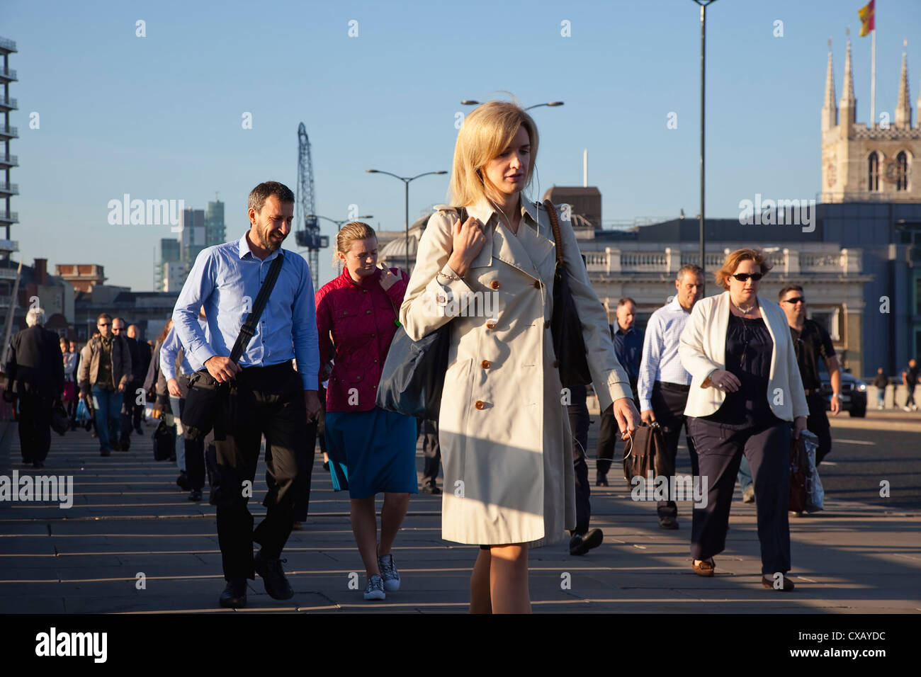 Woman walking across london bridge hi-res stock photography and images ...