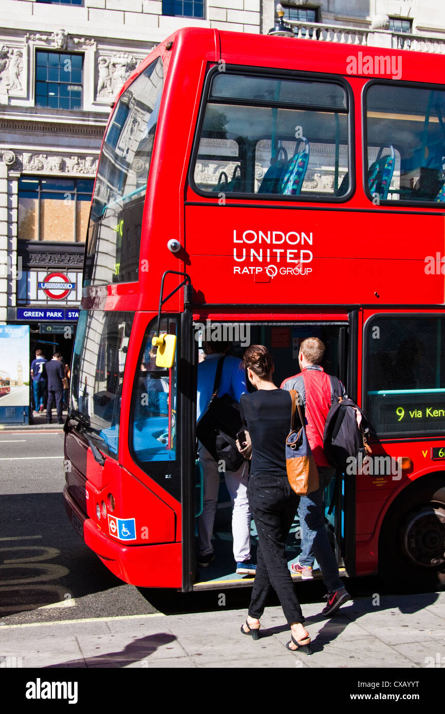 Boarding bus on Piccadilly Stock Photo - Alamy