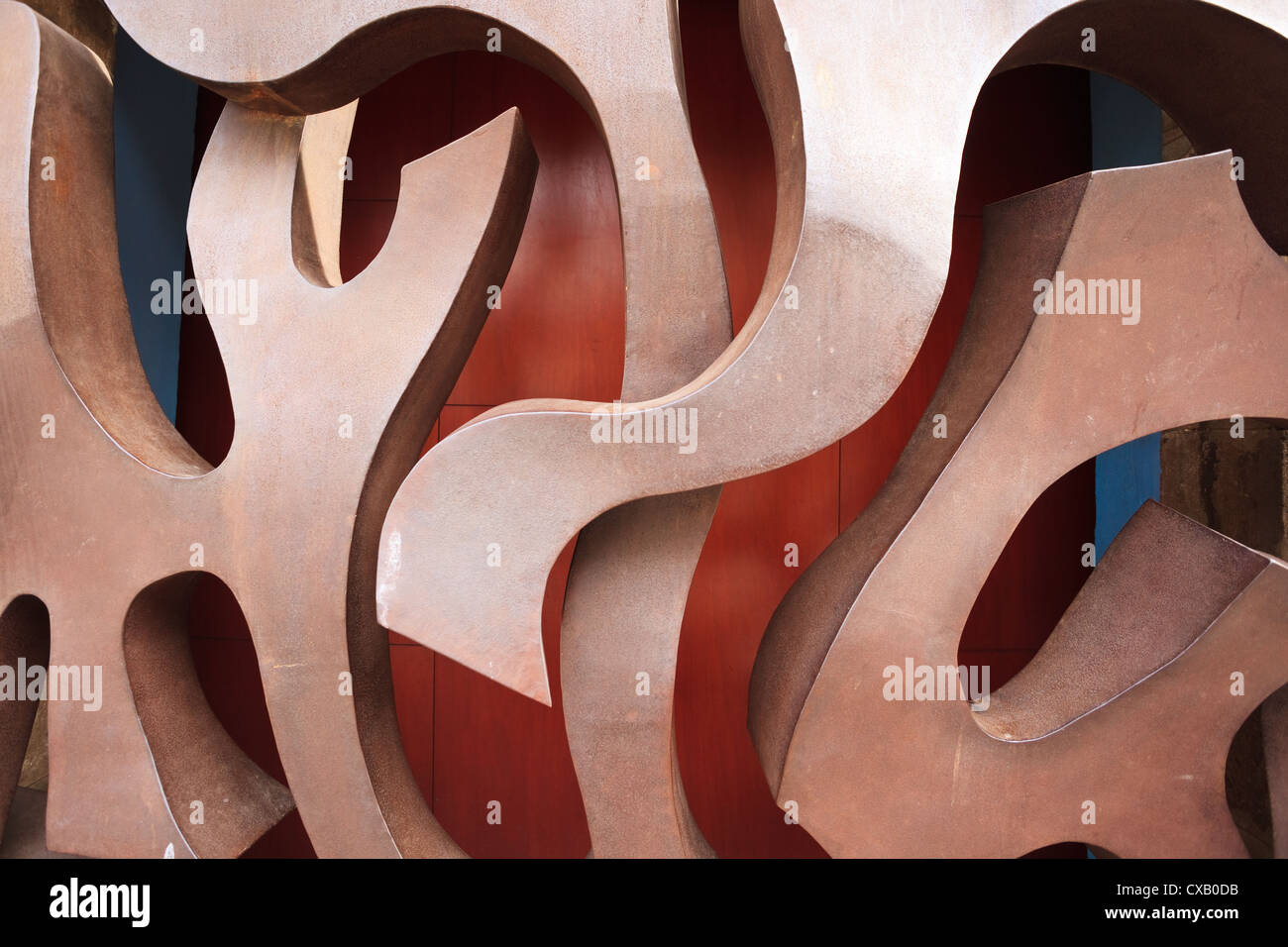 Closeup detail of abstract design of curving and overlapping metal work ...