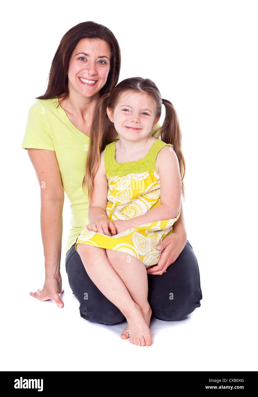 Pretty mother and daughter studio portrait on white Stock Photo - Alamy