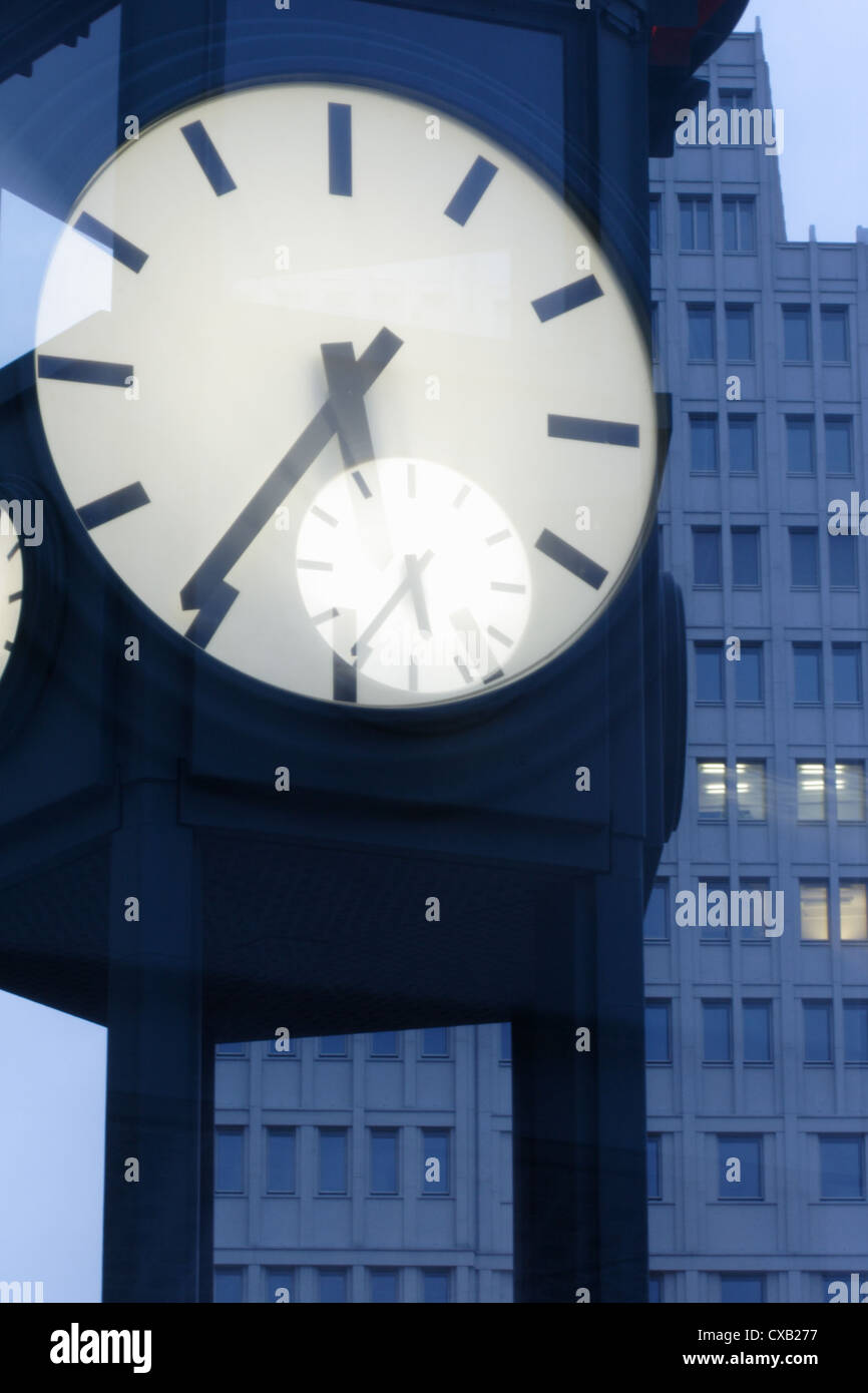 Radiant Clock and office building Stock Photo - Alamy