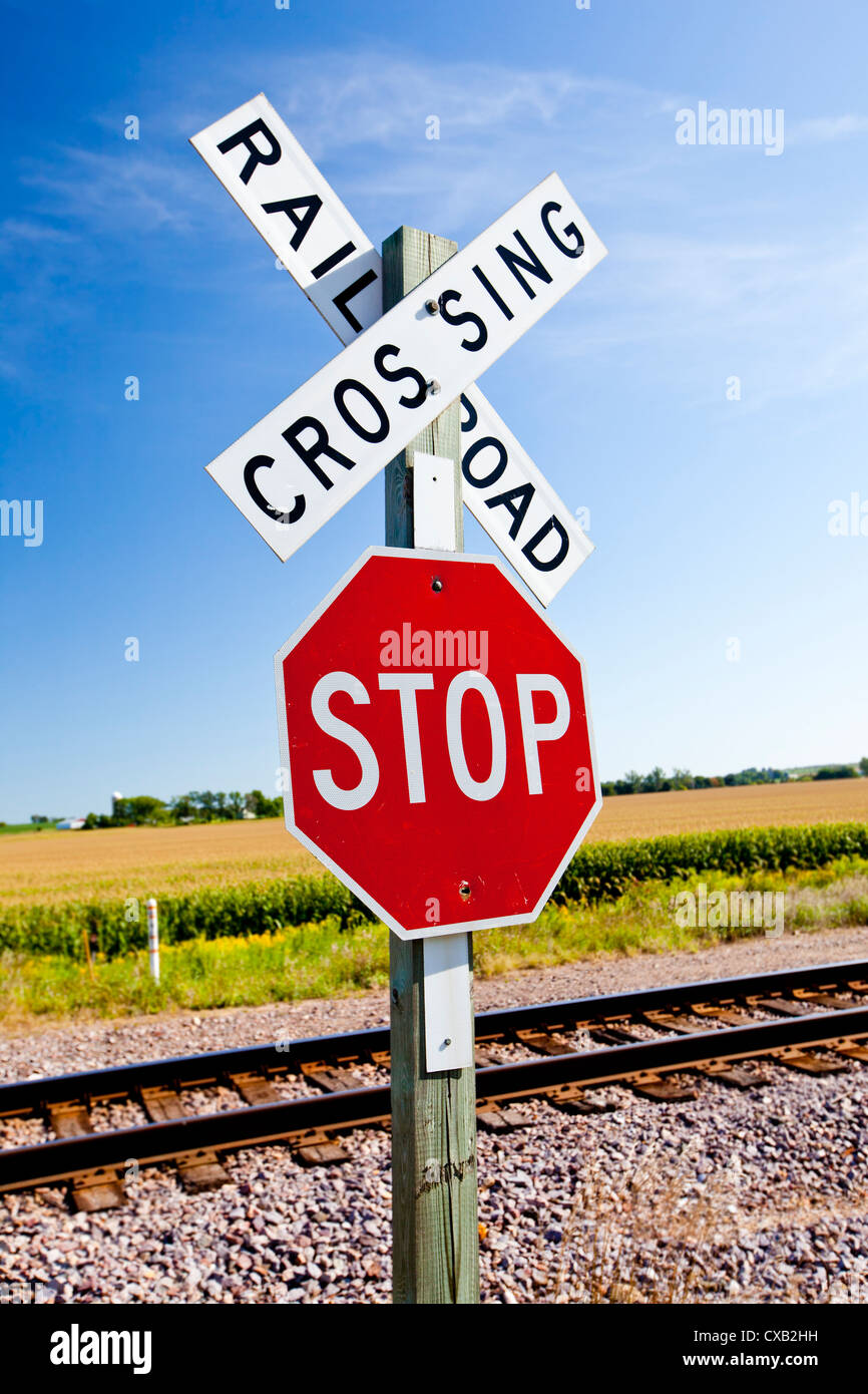 Railroad crossing and stop sign in farmland Stock Photo - Alamy
