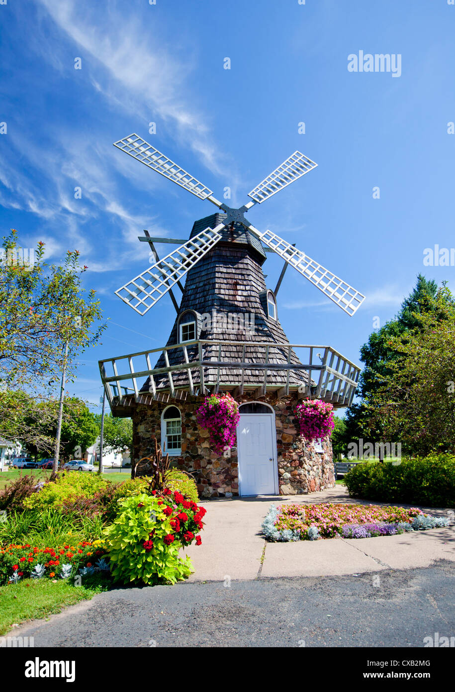 Beautiful windmill surrounded by flowers in the summer Stock Photo - Alamy