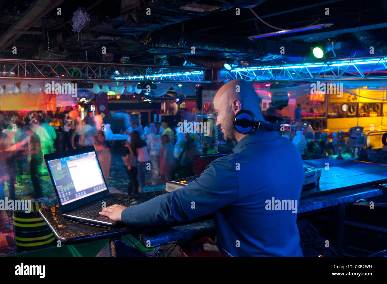 DJ behind the control panel vinyl records Stock Photo - Alamy