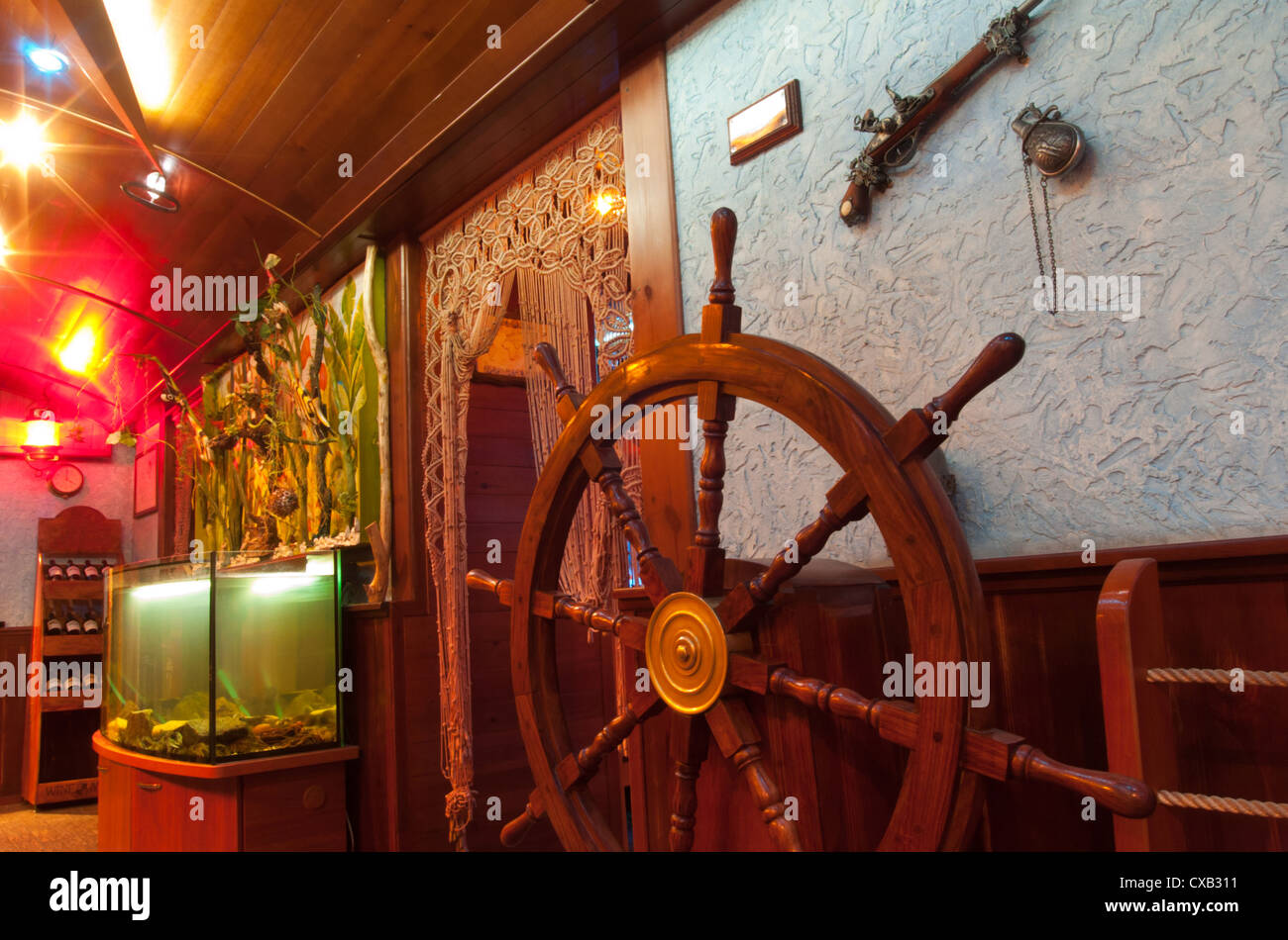 restaurant interior with steering wheel on the wall Stock Photo - Alamy