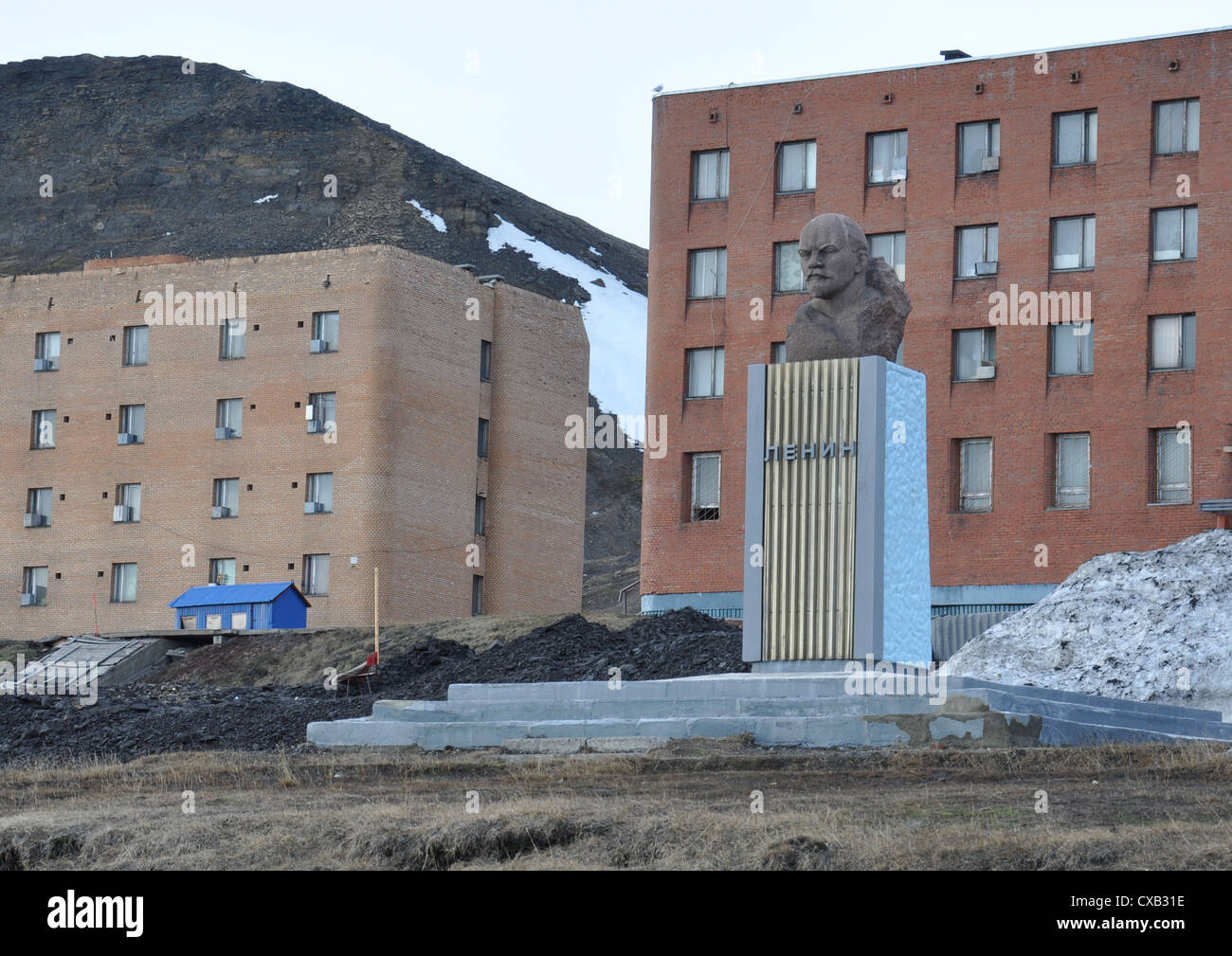 Lenin statue in front of living quarters in the Russian coal mining ...