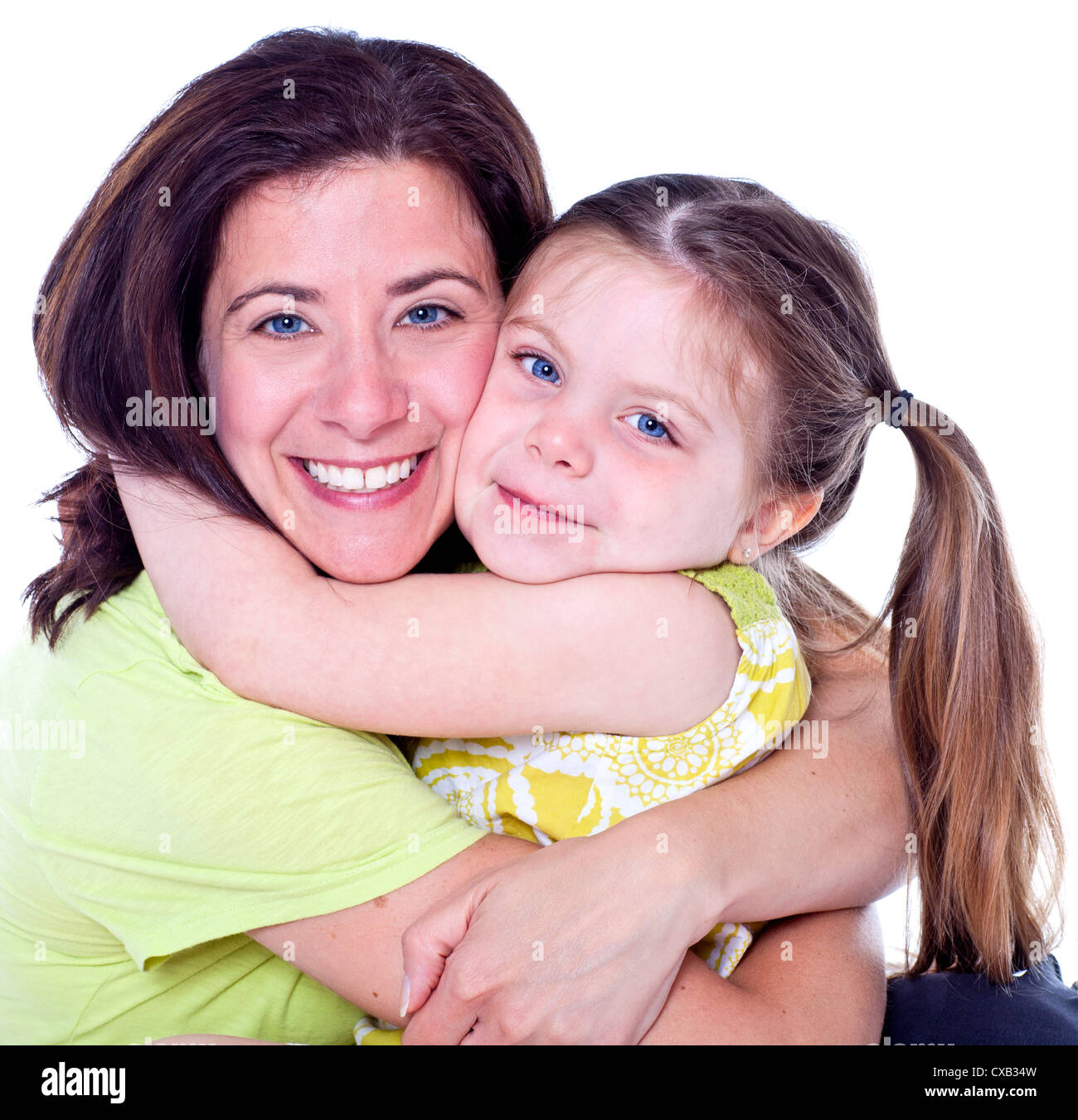 Pretty mother and daughter studio portrait on white Stock Photo - Alamy